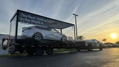 A Tesla Pulling a Tesla: Advertising In Glass Display On Truck Bed ...
